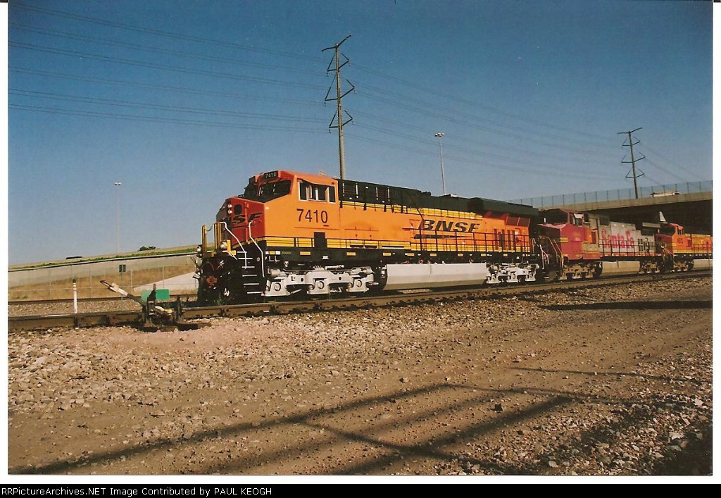 BNSF 7410 wide angled shot as she rolls south to CSprings, Co.